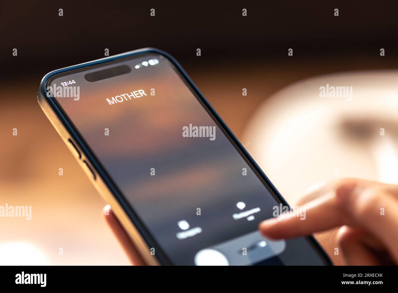 Smartphone in child hands with Incoming Mother call on a screen Stock ...