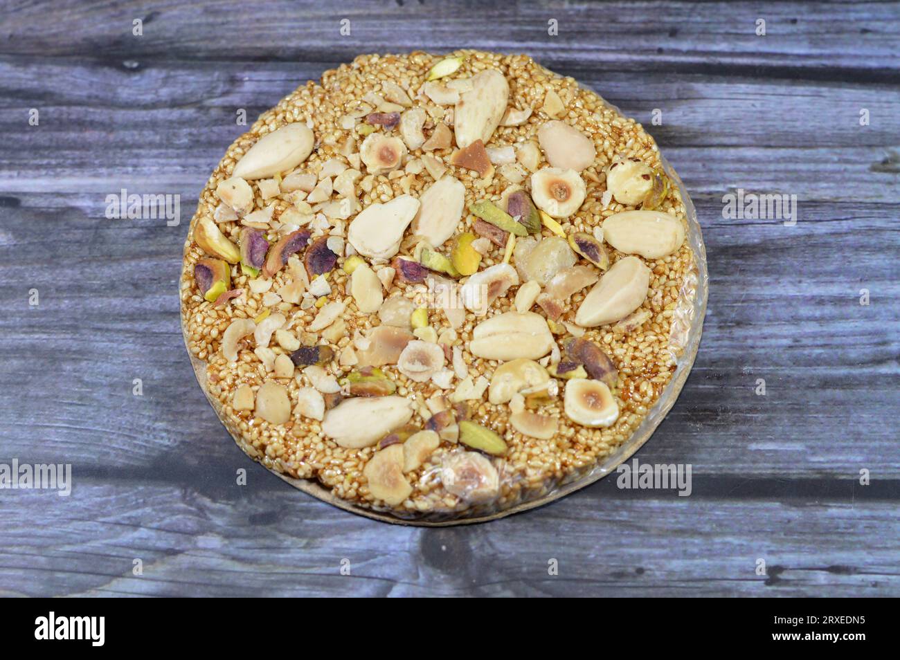 Confectionery sweet circular Eastern candy made of sugar, sesame, nuts ...