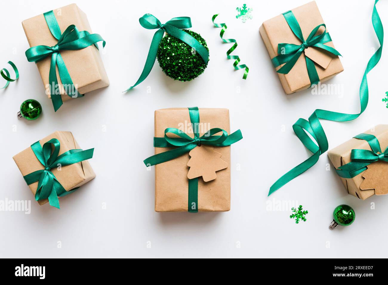 Christmas kraft gifts box with ribbon on colored background. Cozy ...