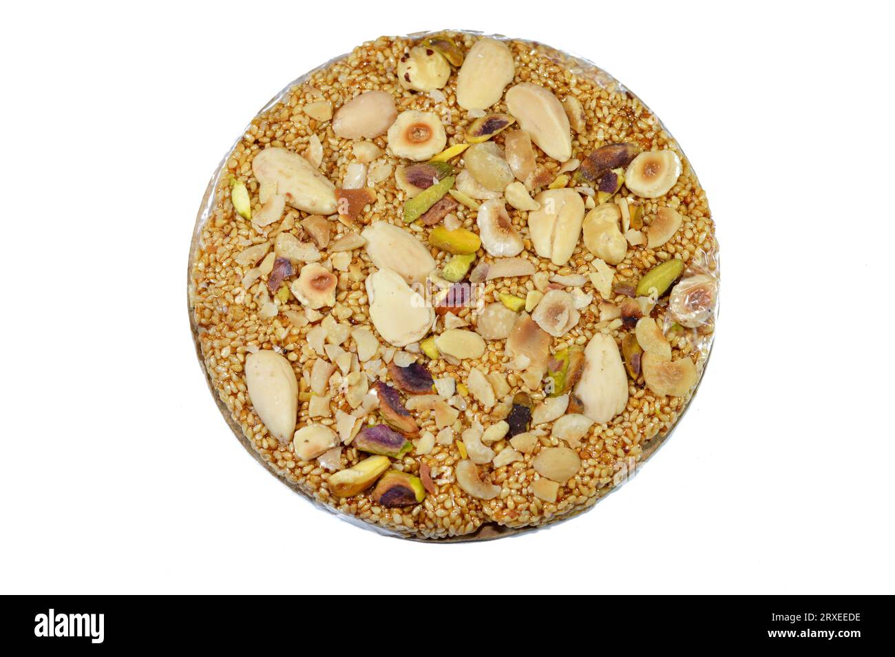 Confectionery sweet circular Eastern candy made of sugar, sesame, nuts ...