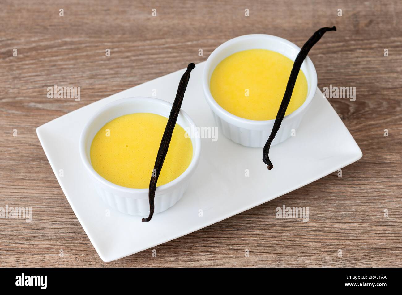 Homemade vanilla custard on wooden table background Stock Photo - Alamy