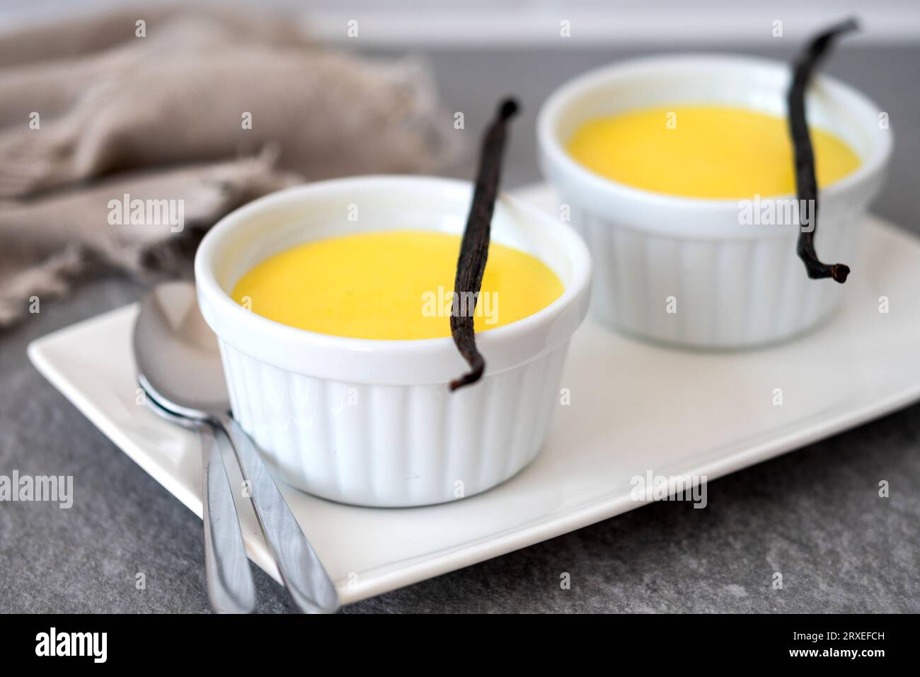 Homemade vanilla custard on wooden table background Stock Photo - Alamy