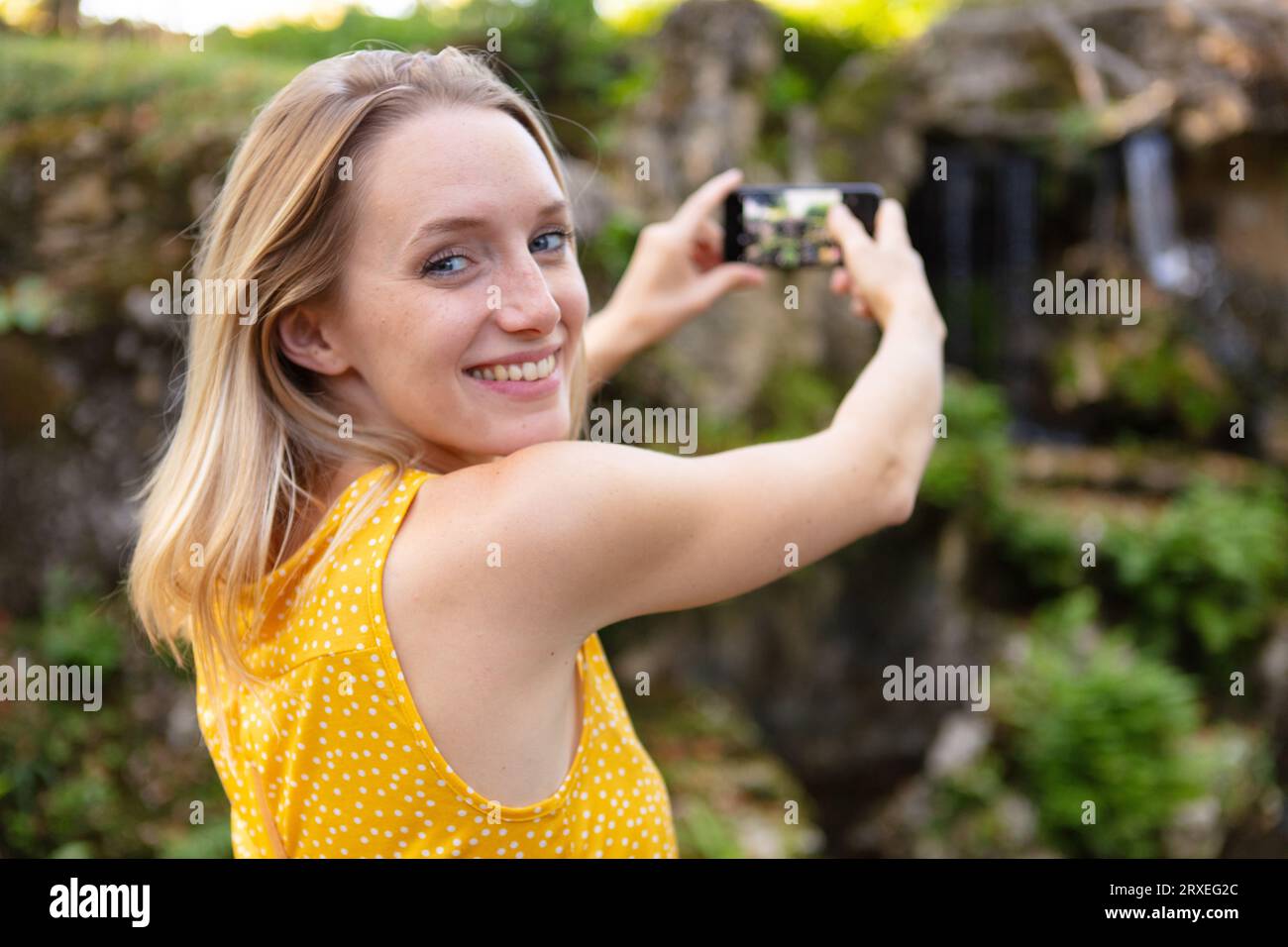 Beautiful woman takes pictures in hi-res stock photography and images ...