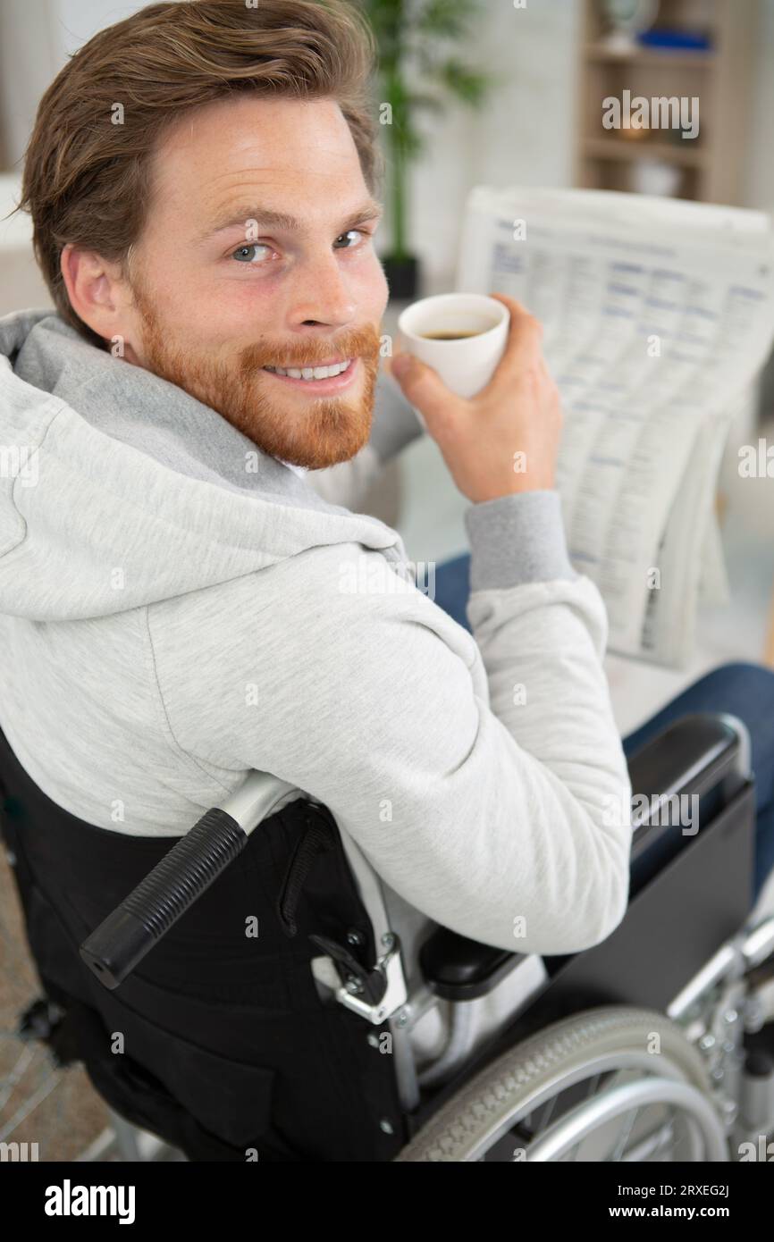 happy disable man having coffee indoors Stock Photo - Alamy