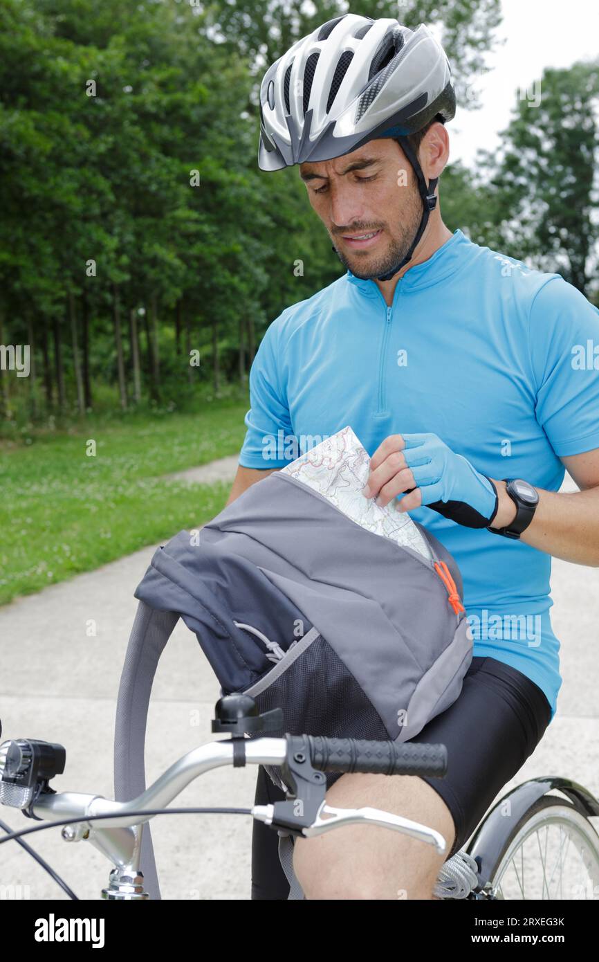 Biker looking at map hi-res stock photography and images - Alamy