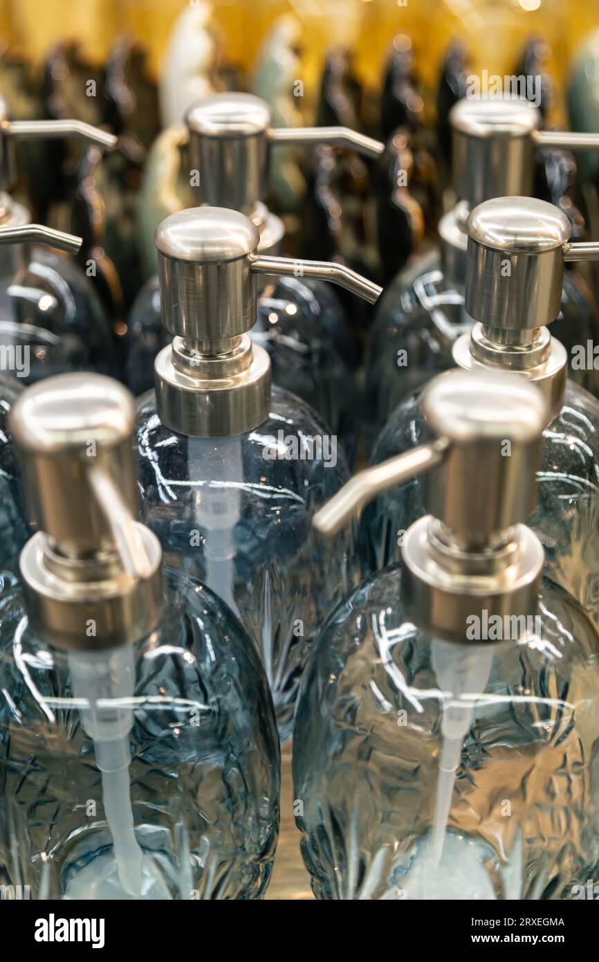 Containers for liquid soap or shampoo with a dispenser is sold in a ...