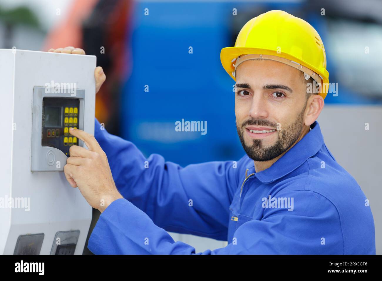 using the machine and pressing on buttons in the factory Stock Photo ...