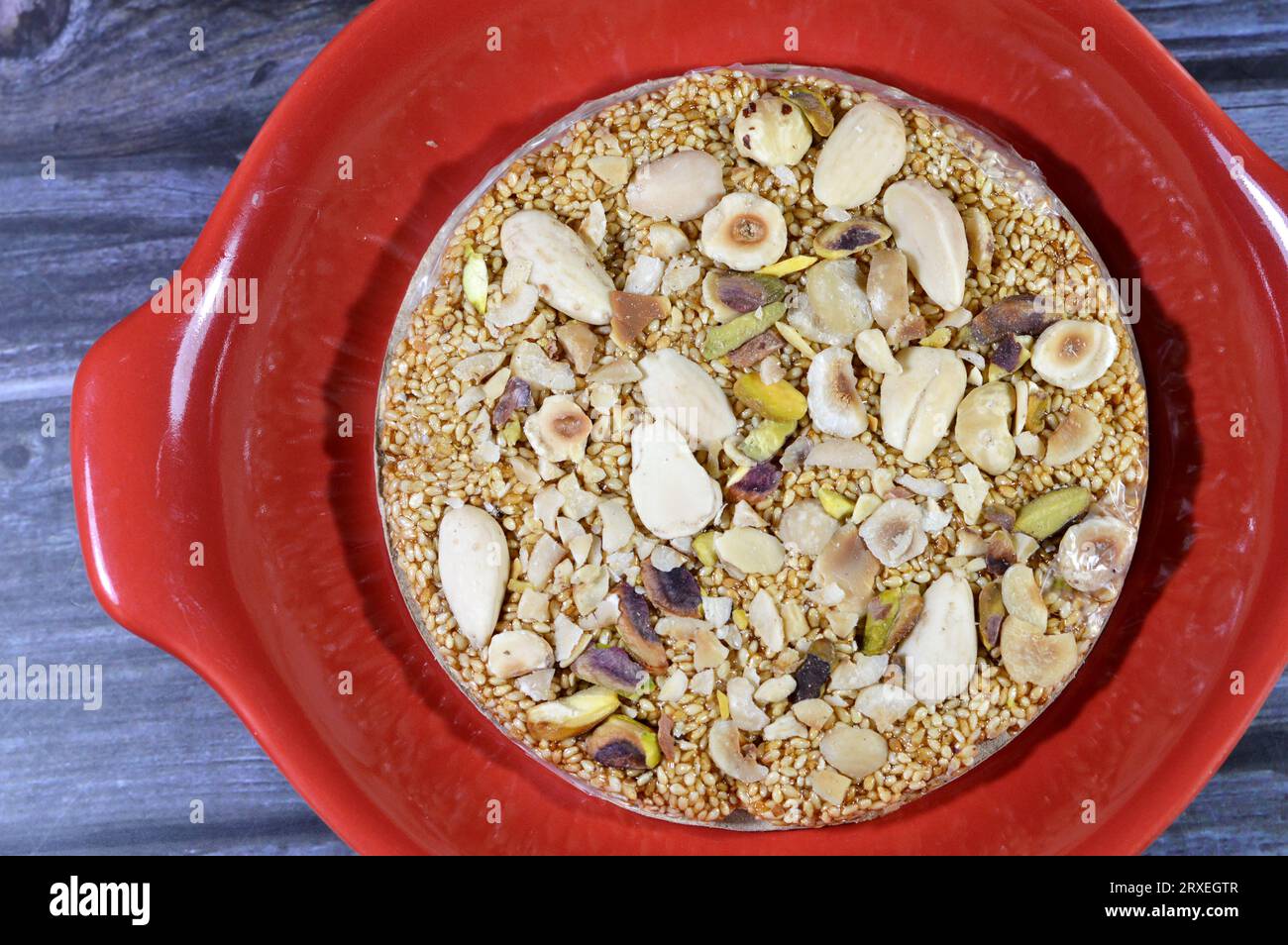 Confectionery sweet circular Eastern candy made of sugar, sesame, nuts ...