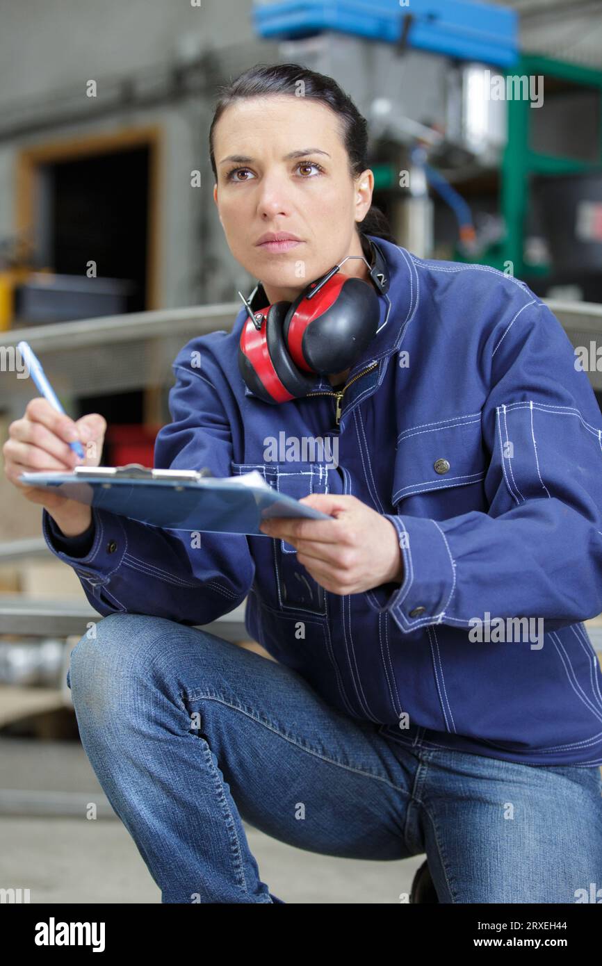 warehouse inventory manager checking distribution in warehouse storage ...