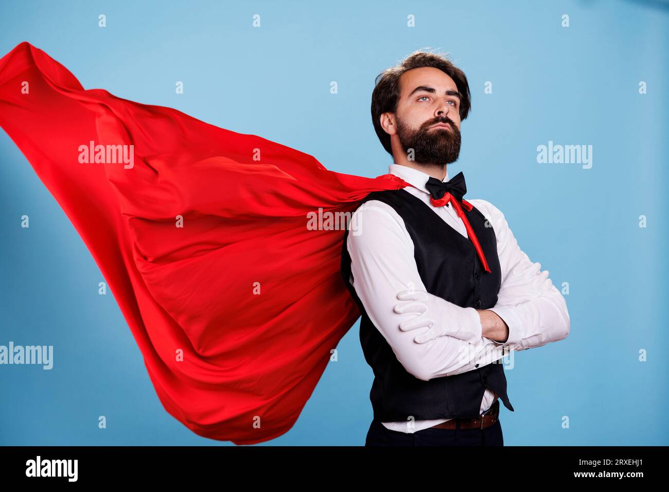 Strong man superhero with fantasy cape feeling confident in front of ...