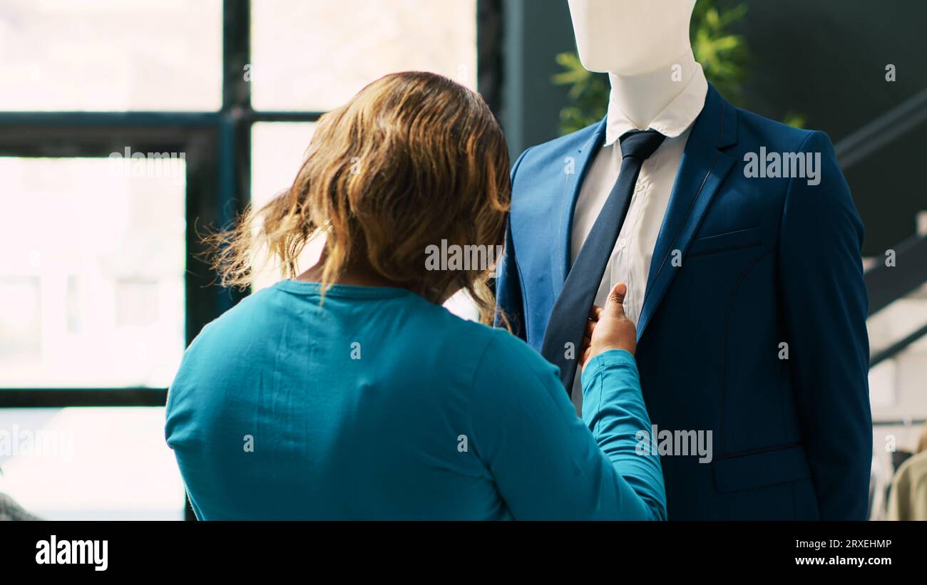 Shopper checking elegant suit hi-res stock photography and images - Alamy