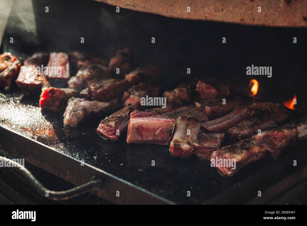 Cooking meat on a barbecue grill Stock Photo - Alamy