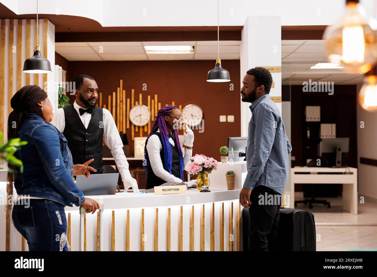 Unhappy customer at hotel front desk hi-res stock photography and ...