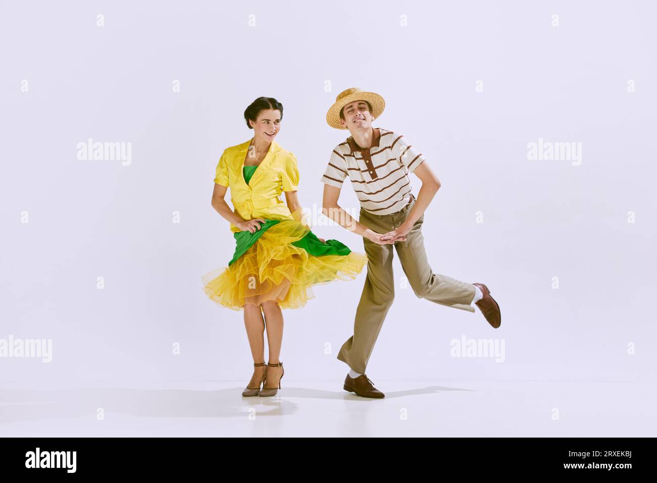 Enjoyment and fun. Young beautiful couple, man and woman dancing ...