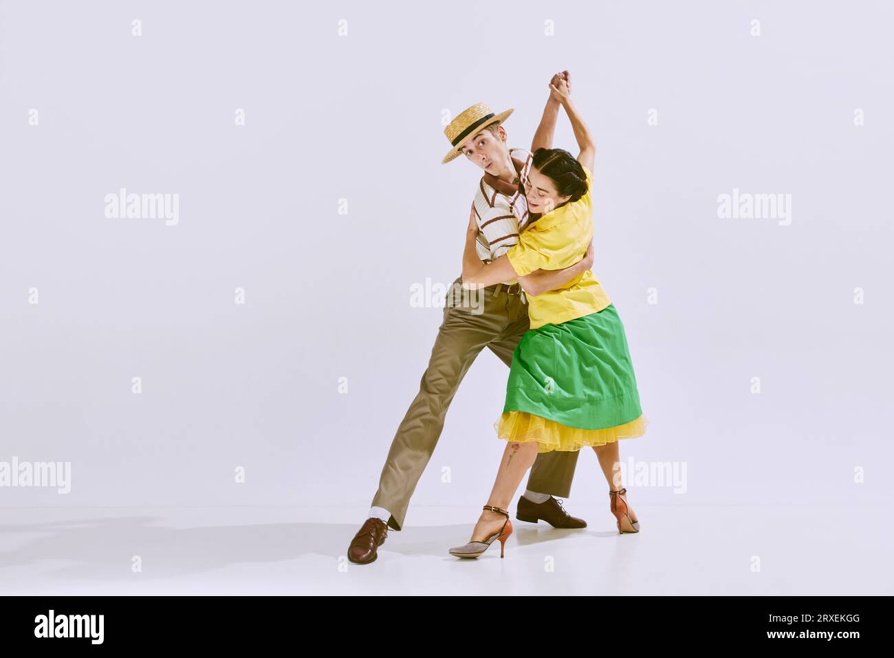 Lala, lindy hop. Beautiful, stylish young mana nd woman dancing ...