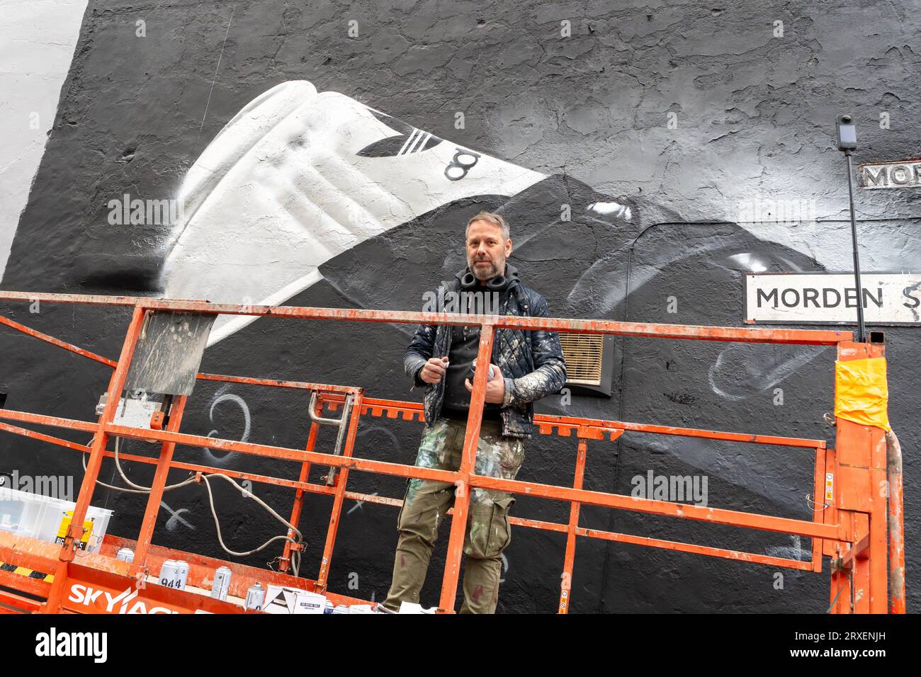 Aerosol artist Jody Thomas at work on a commission by Adidas Originals ...