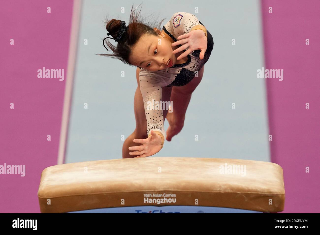 Yi-Chen Lin of Taiwan competes on the vault at the women's team ...