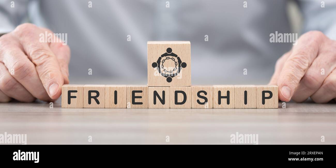 Wooden blocks with symbol of friendship concept Stock Photo - Alamy