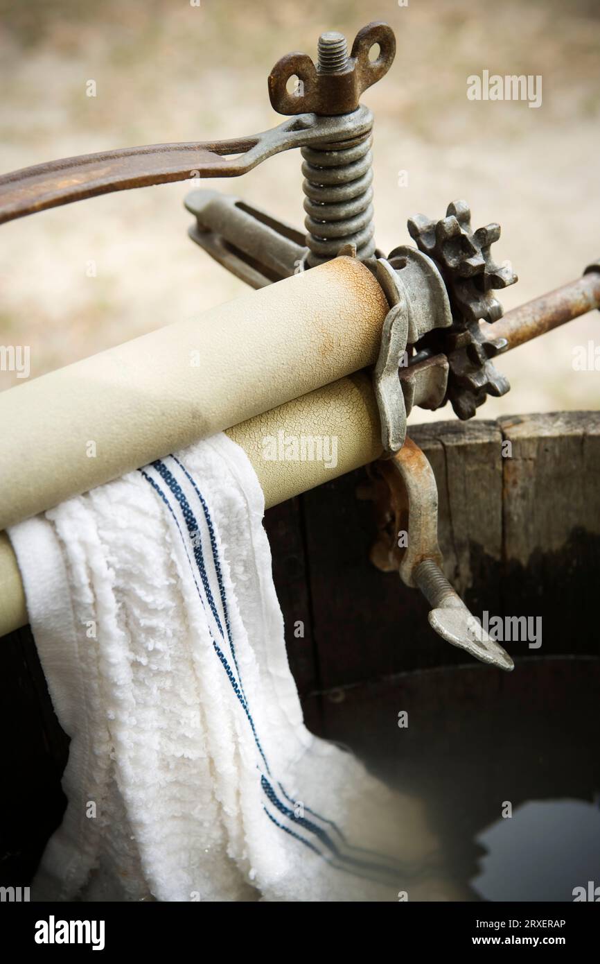 Wringing out laundry on a mangle Stock Photo - Alamy