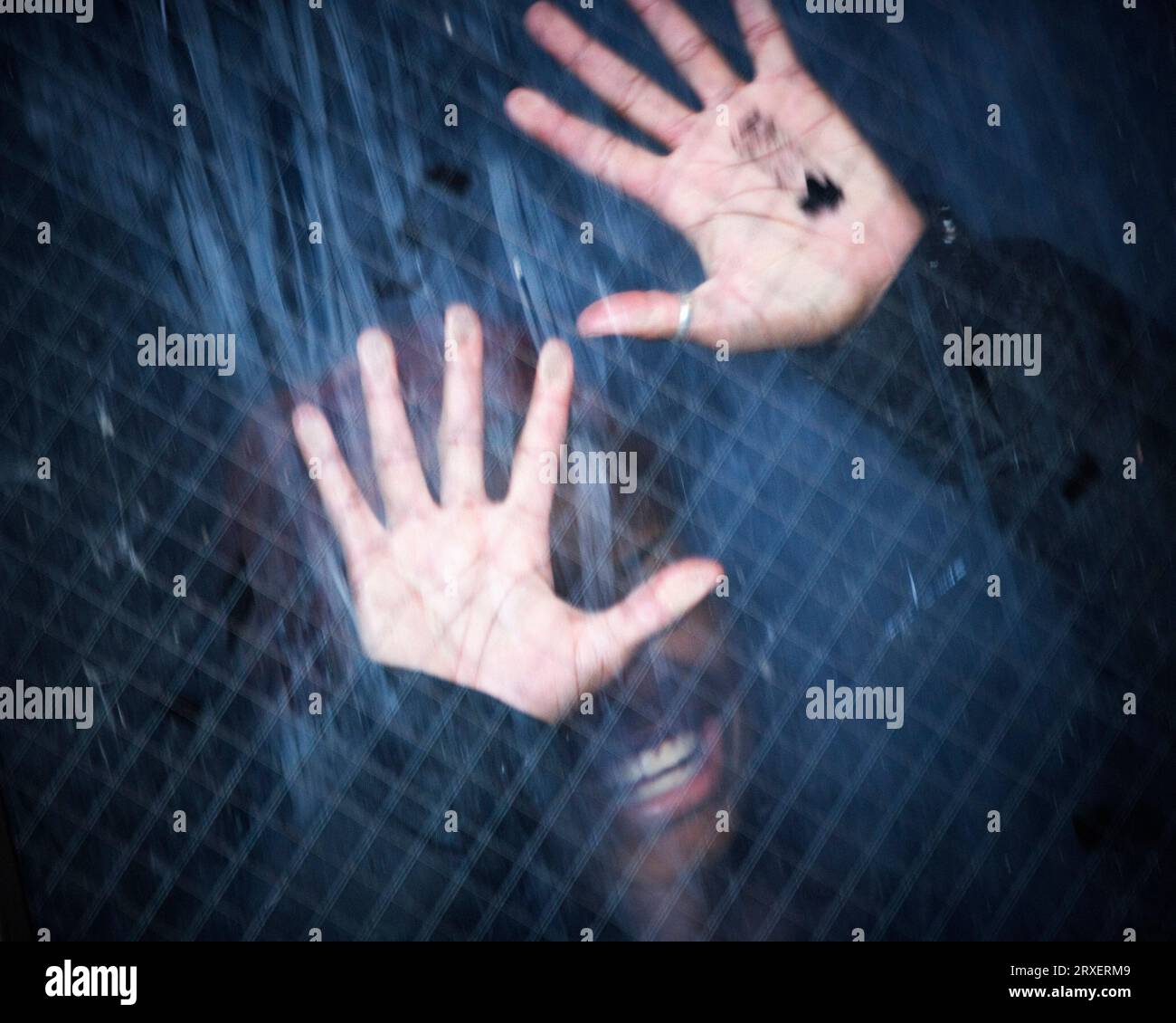 Hands pressed against window hi-res stock photography and images - Alamy