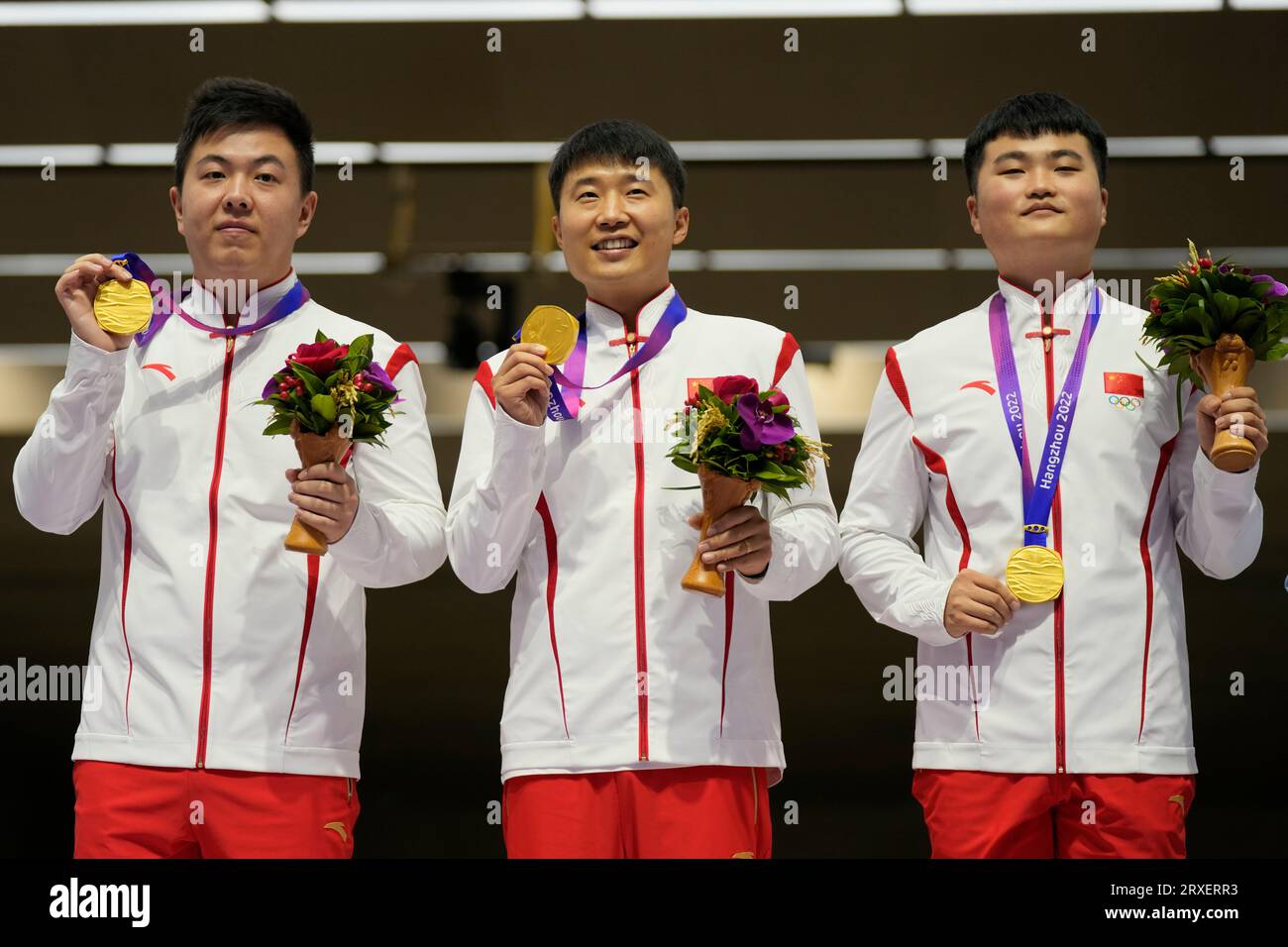 Gold medalists of China, Xinjie Wang, left, Yuehong Li, center, and ...