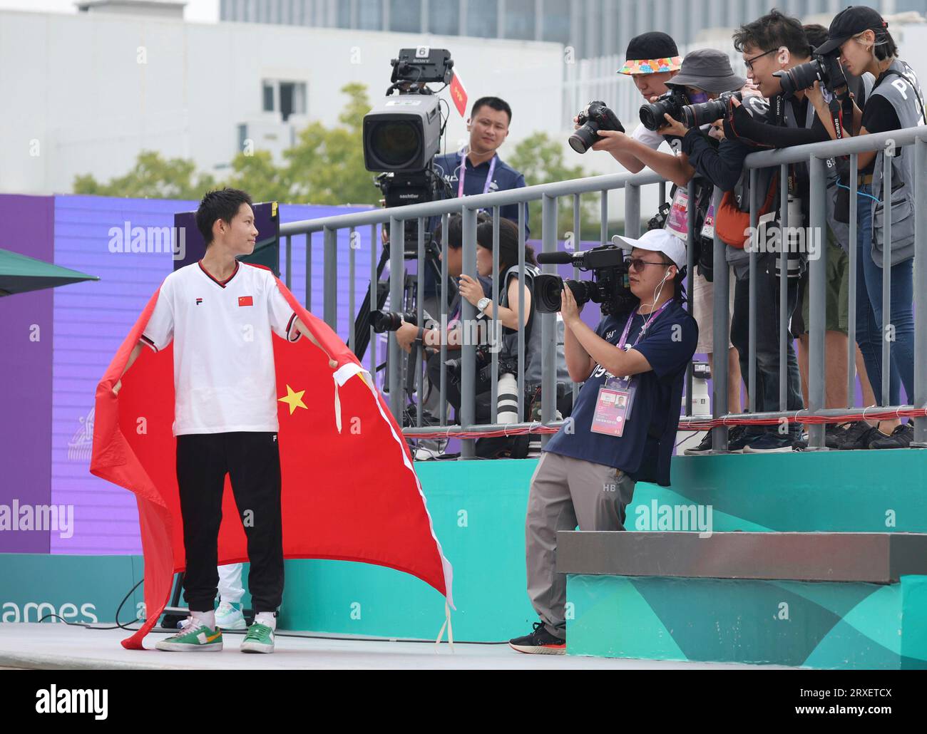Chen Ye of China with a national flag celebrates after winning the Men ...