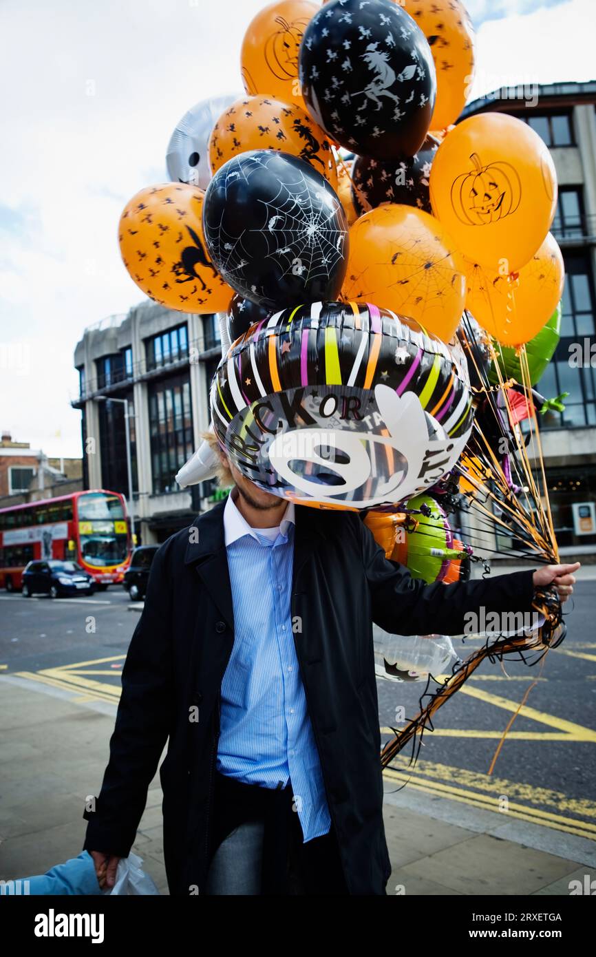Man carrying balloon hi-res stock photography and images - Alamy