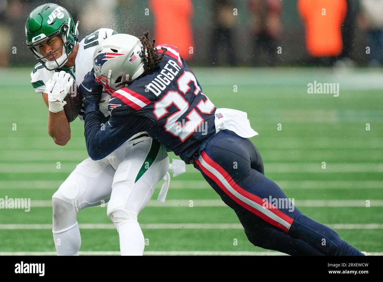 New England Patriots safety Kyle Dugger (23) tackles New York Jets wide ...