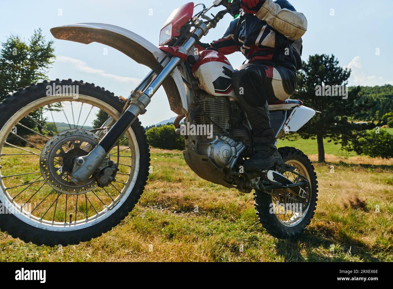 A fearless professional motocross rider skillfully executes an extreme ...