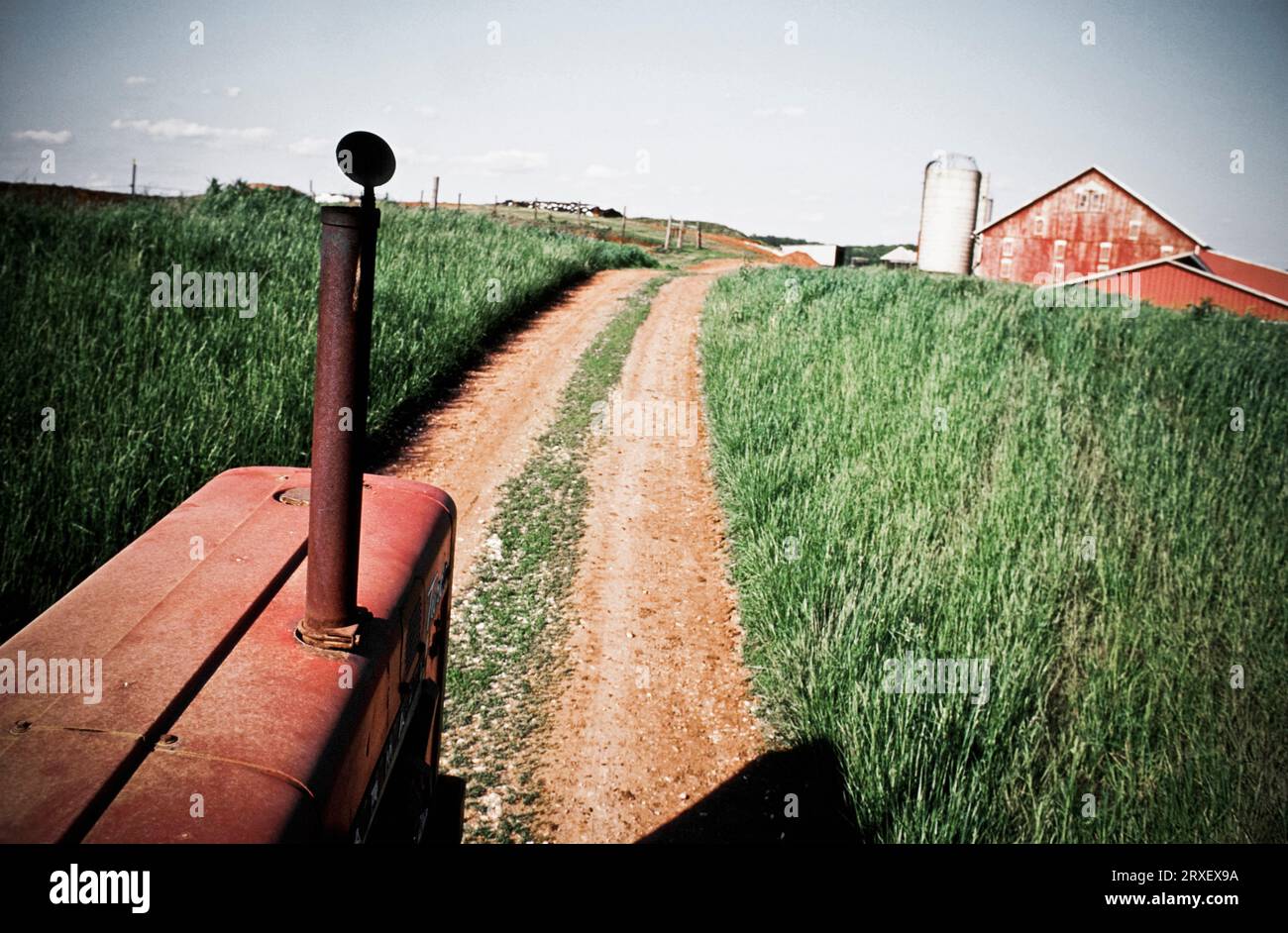 View from the top of the tractor looking toward the barn of a family ...