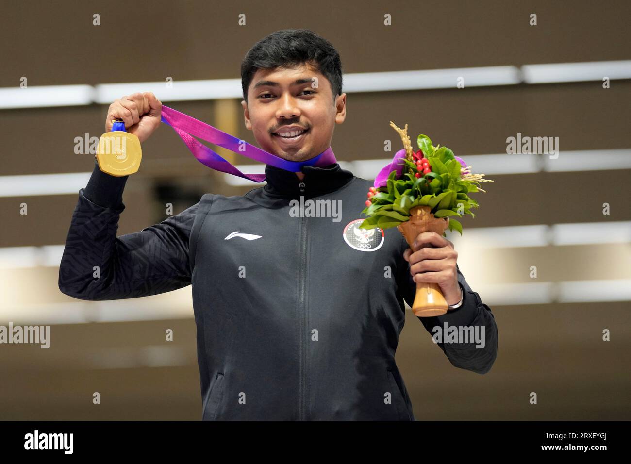 Gold medalist Muhammad Sejahtera Dwi Putra of Indonesia poses during ...