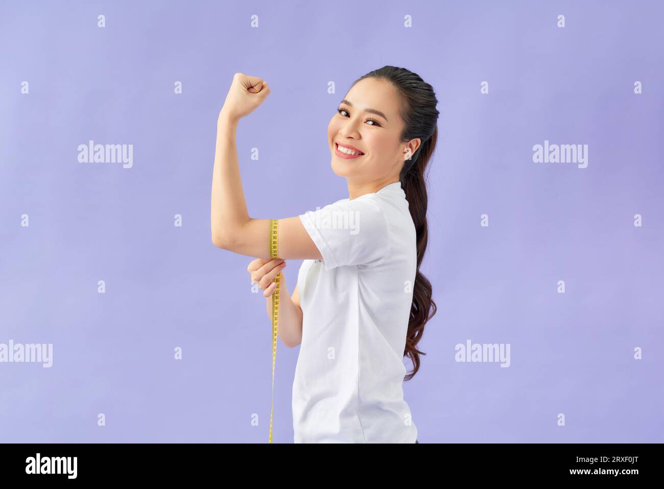 asian woman checking her upper arm Stock Photo - Alamy