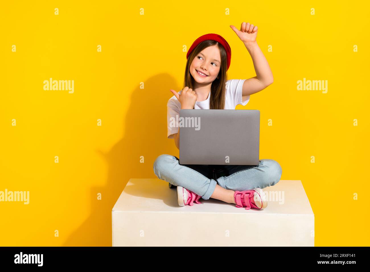Full size photo of adorable schoolgirl sit cube netbook point look ...