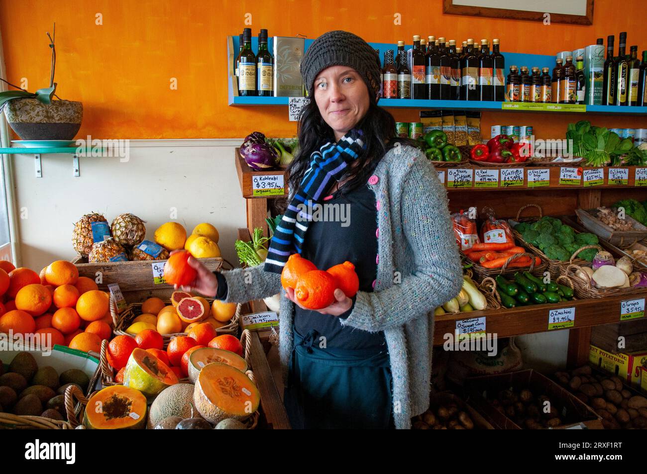 Shop assistant in an organic grocery store and health food shop Stock ...