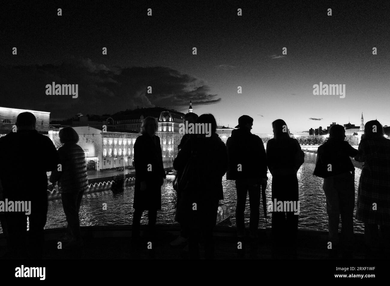Moscow. Bridge over the Moskva River. Silhouettes of people. Evening ...