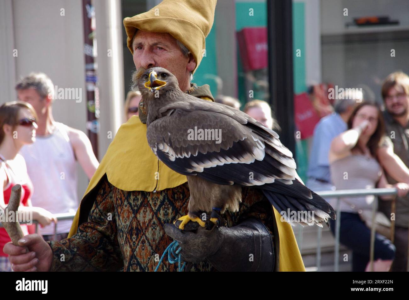 August 19, 2012. Charcter with a bird of prey in The Procession of the ...