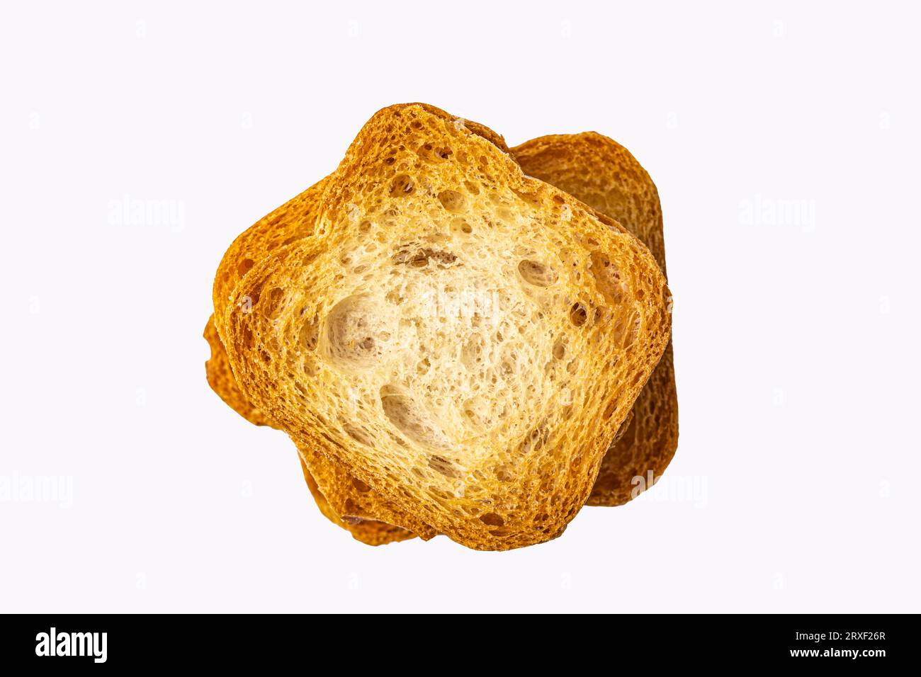 square pieces of dry white bread on a white background, top view. High ...