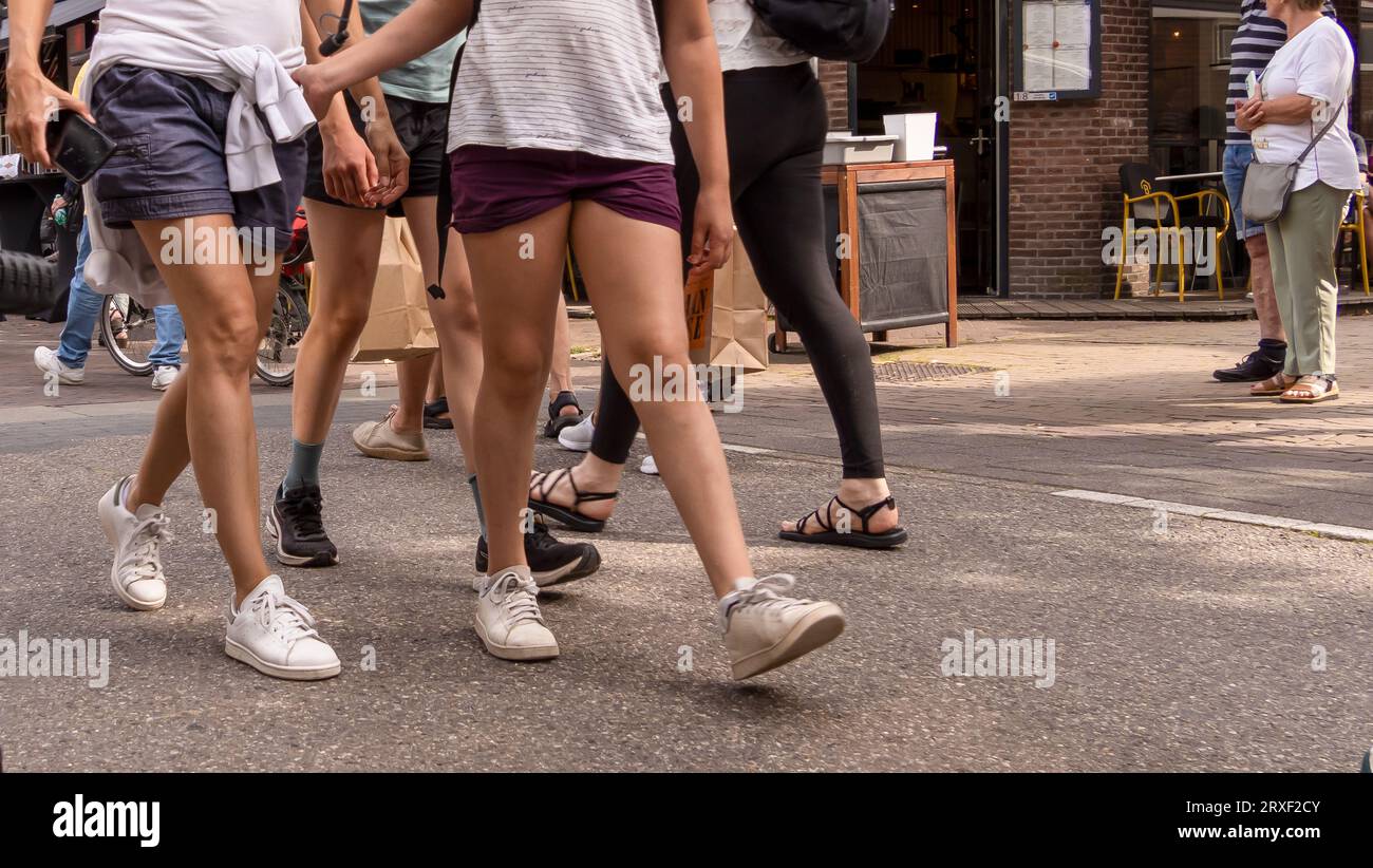 Pedestrians walking along in a pedestrian area in summertime Stock ...
