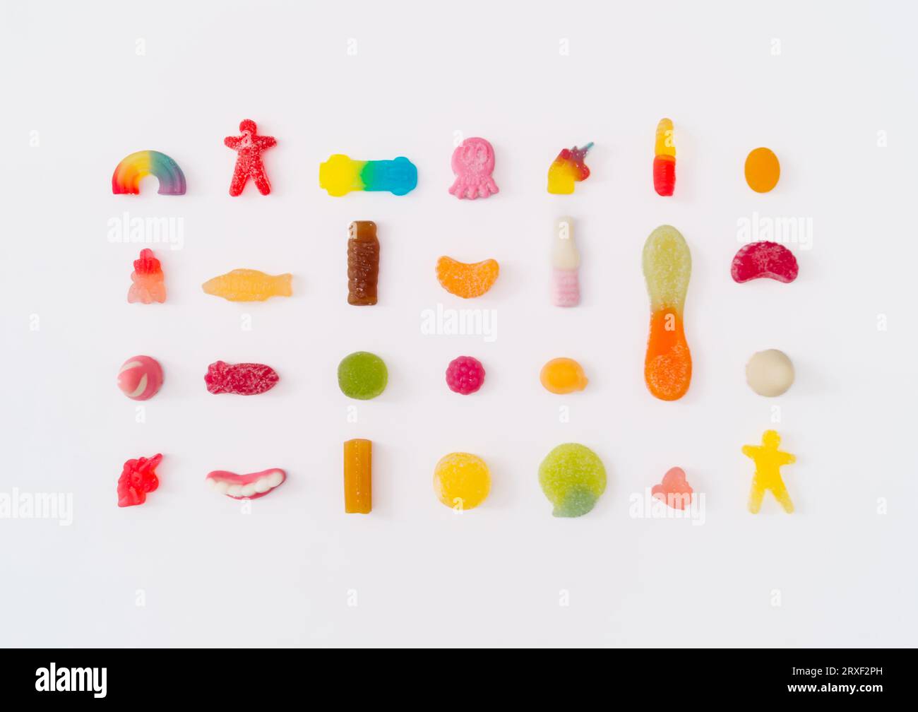 Creative pattern made of colorful gummy candies on white background ...