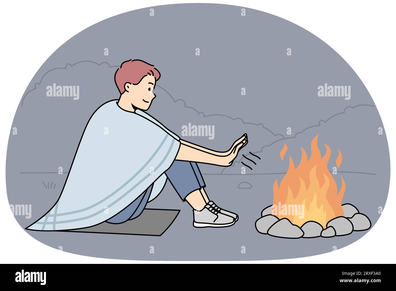 Young man sit on ground in nature warm hands at campfire at night ...