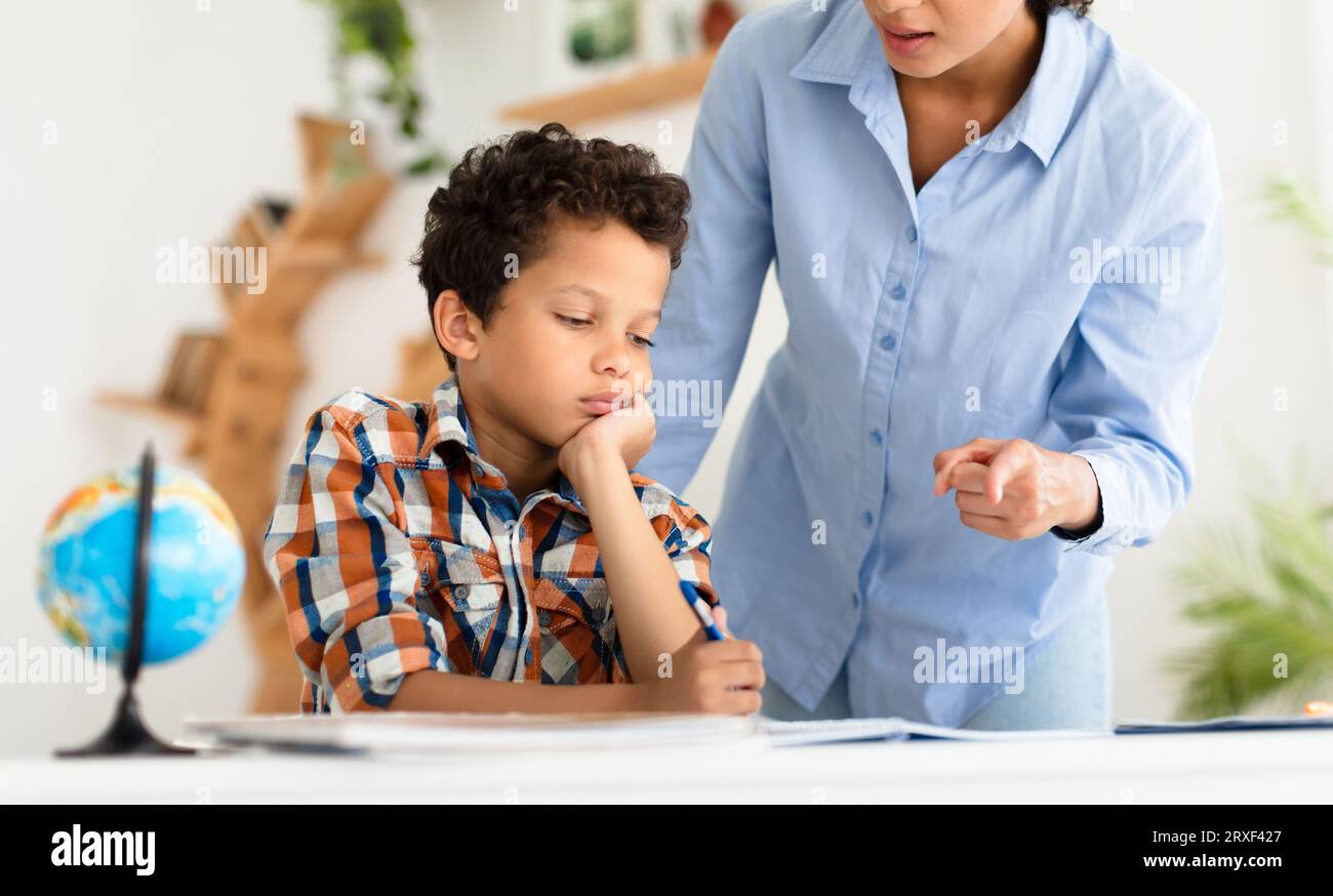 Strict School Teacher Woman Scolding Unhappy Little Schoolboy At ...