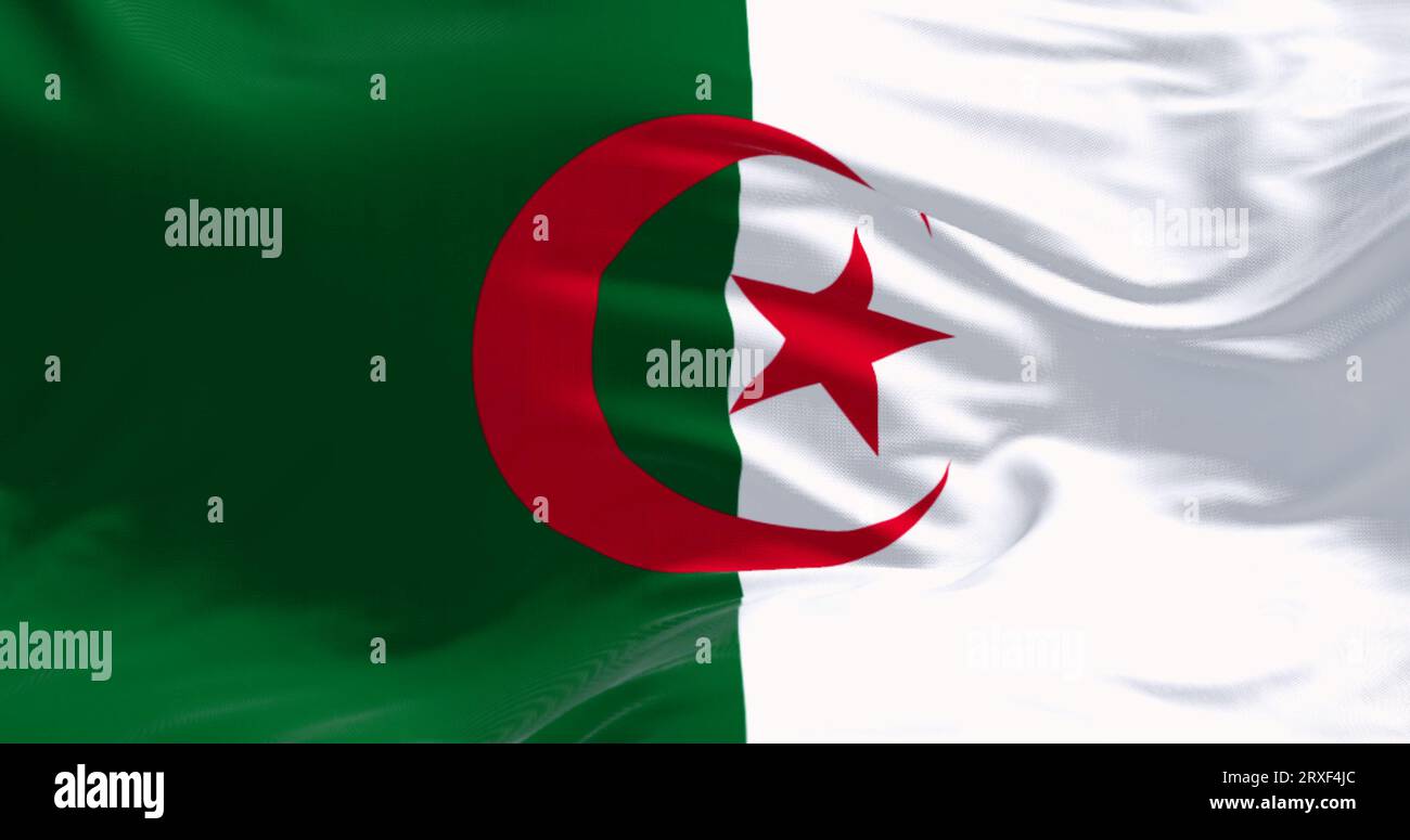 Close-up of national flag of Algeria waving on a clear day. two ...