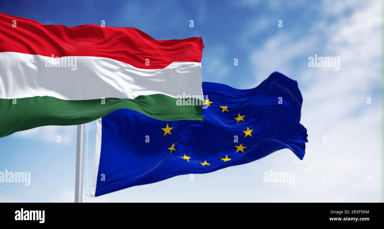 Flags of Hungary and the European Union fluttering together on a clear ...
