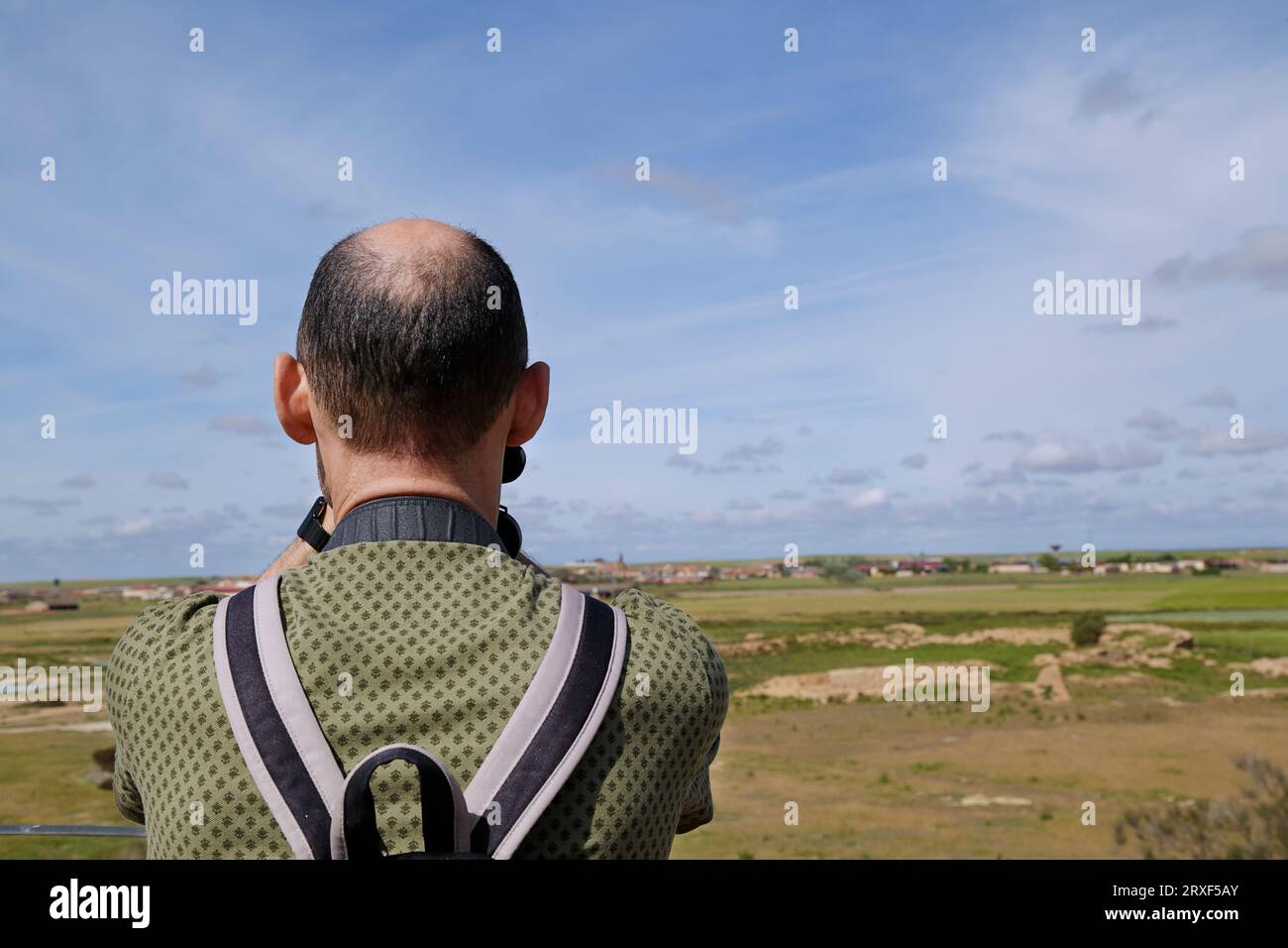 Man watching birds with binoculars Stock Photo - Alamy