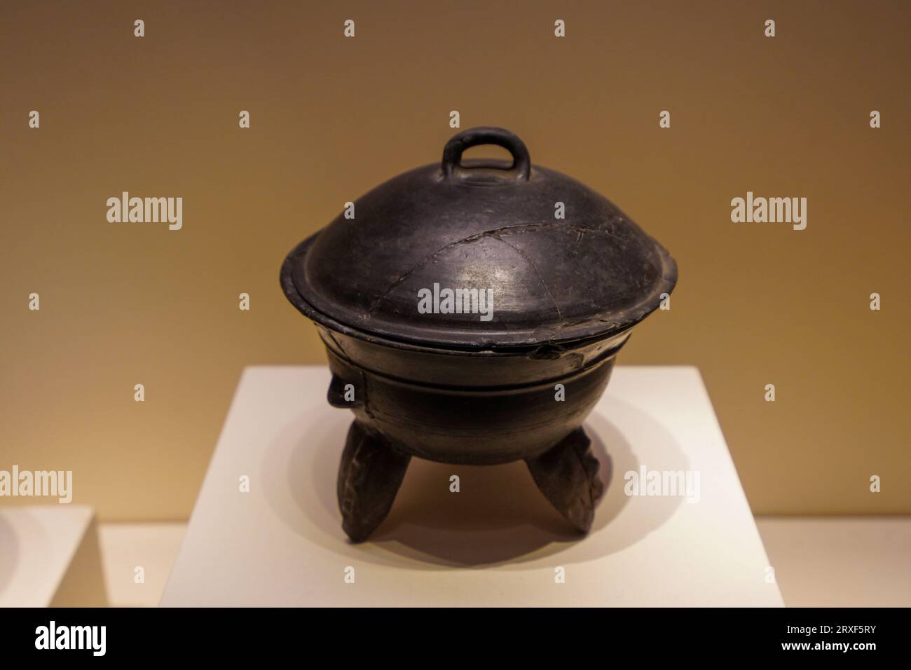 Beijing China, February 17, 2023: Longshan culture Black Pottery Ding ...