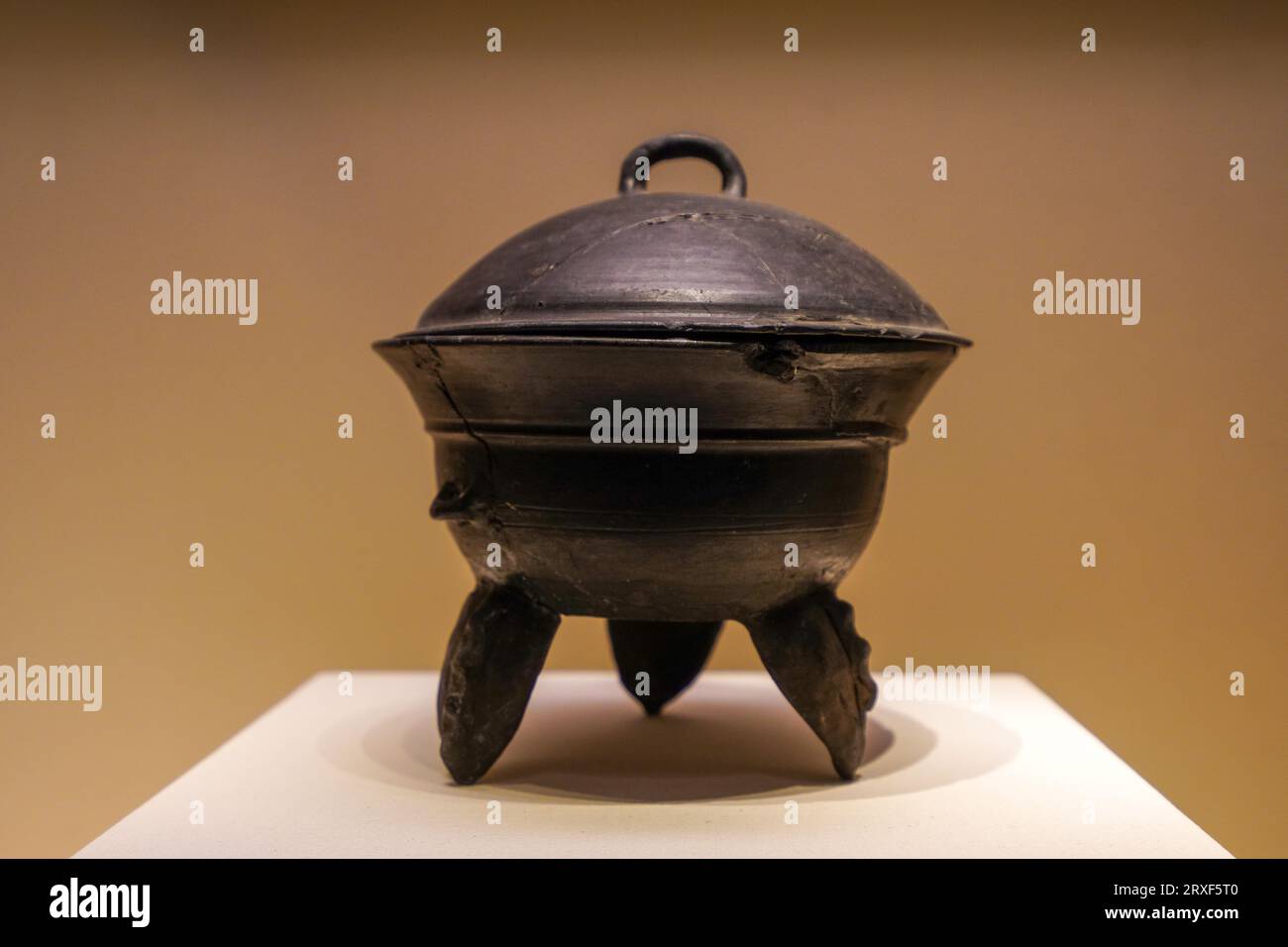 Beijing China, February 17, 2023: Longshan culture Black Pottery Ding ...