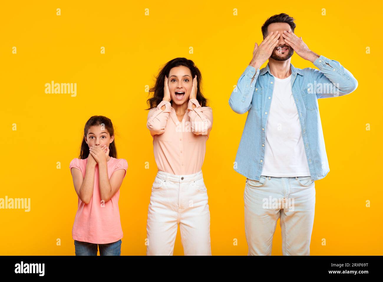 Hear no evil, see no evil, speak no evil. Family of three people ...