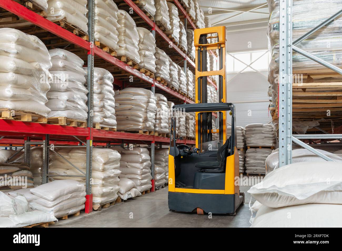 Forklift in food storage warehouse Stock Photo - Alamy
