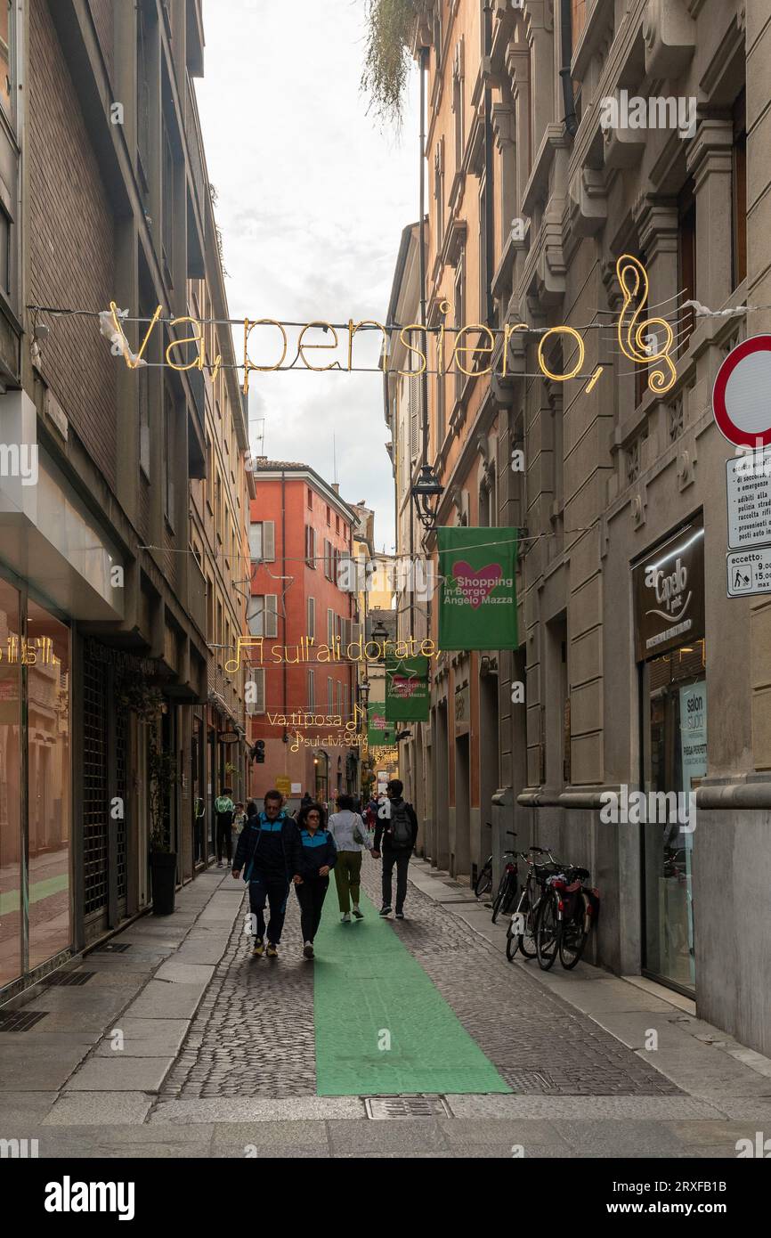 Alley decorated with a light installation with the words of the chorus ...