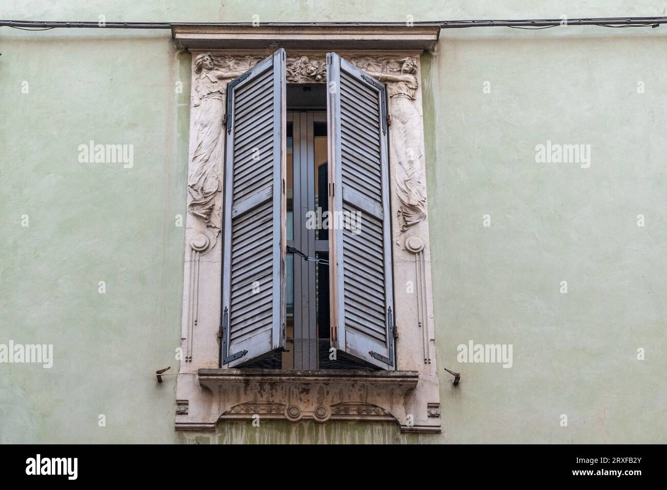 Window decorated with a bas-relief in Art Nouveau style, popular ...